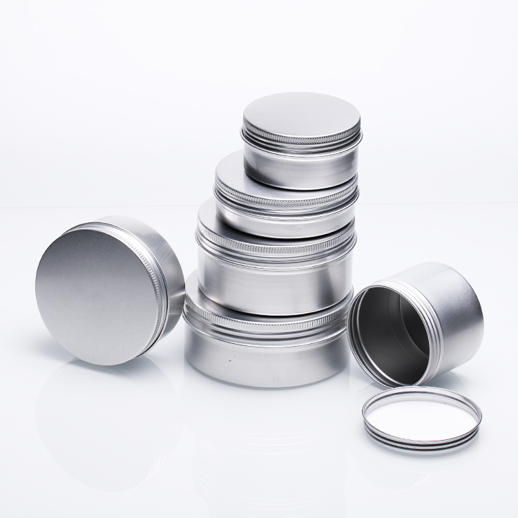 Silver round screw top aluminum jar